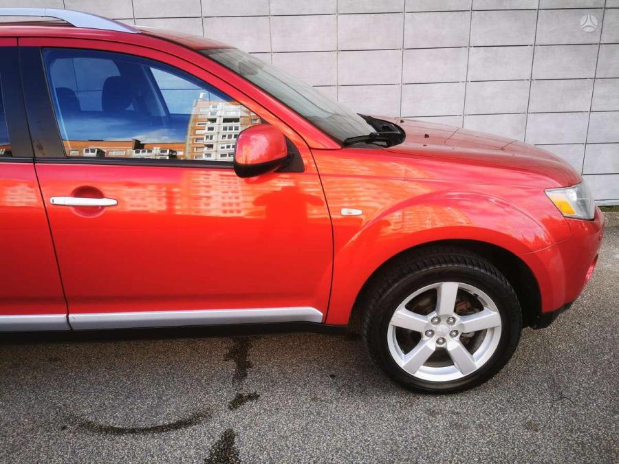 Red Mitsubishi Outlander 2009 in Klaipeda, with an engine capacity of 2.20 L and mileage of 216 thousand km for 4190 €, photo 15 on AUTOMOTO.COM.LV