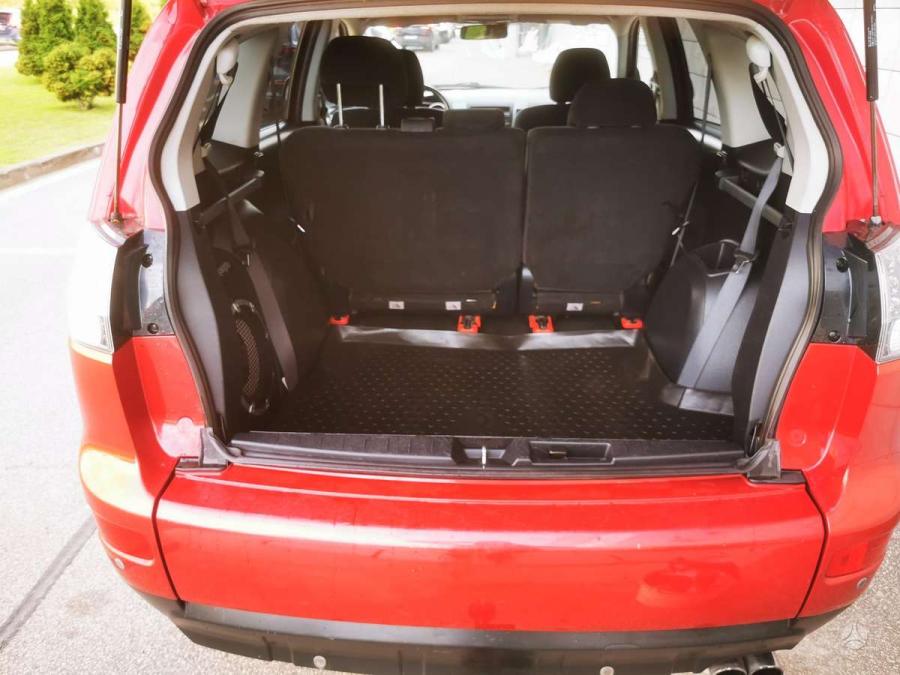 Red Mitsubishi Outlander 2009 in Klaipeda, with an engine capacity of 2.20 L and mileage of 216 thousand km for 4190 €, photo 24 on AUTOMOTO.COM.LV