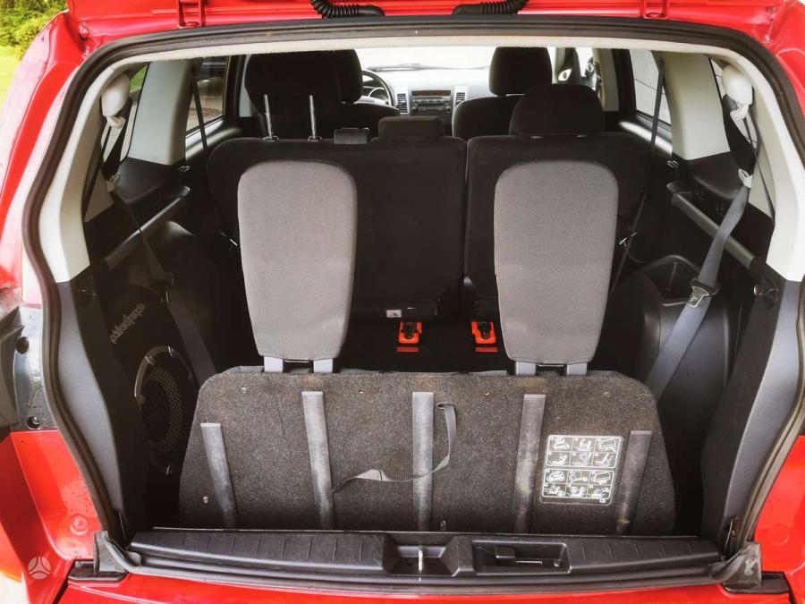 Red Mitsubishi Outlander 2009 in Klaipeda, with an engine capacity of 2.20 L and mileage of 216 thousand km for 4190 €, photo 26 on AUTOMOTO.COM.LV
