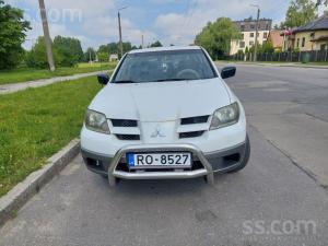 White Mitsubishi Outlander 2004 in Riga, with an engine capacity of 2.40 L and mileage of 214 thousand km for 850 €, photo 12 on AUTOMOTO.COM.LV