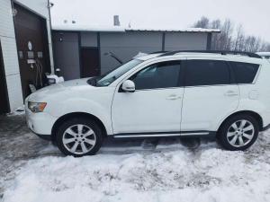 White Mitsubishi Outlander 2011 in Utena, with an engine capacity of 2.18 L and mileage of 166 thousand km for 3300 €, photo 2 on AUTOMOTO.COM.LV