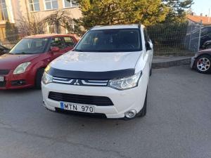 Balts Mitsubishi Outlander 2014 Kauņa, ar dzinēja tilpumu 2.27 L un nobraukumu 258 tūkst. km par 7900 €, foto  vietnē AUTOMOTO.COM.LV