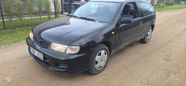 Black Nissan Almera 1997 in Vilnius, with an engine capacity of 1.39 L and mileage of 165 thousand km for 380 €, photo 1 on AUTOMOTO.COM.LV