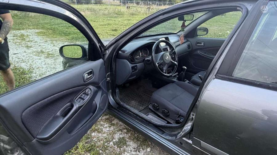 Brūns Nissan Almera 2004 Viļņa, ar dzinēja tilpumu 1.50 L un nobraukumu 320 tūkst. km par 550 €, foto 10 vietnē AUTOMOTO.COM.LV