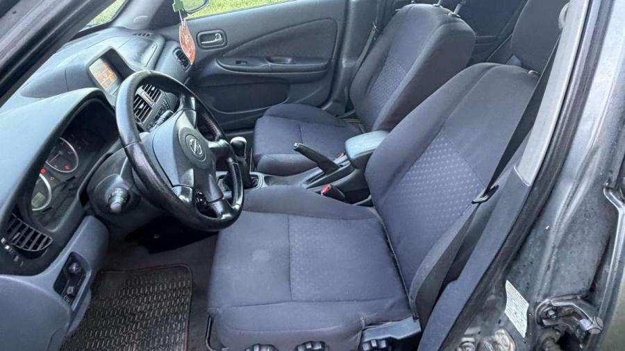 Brūns Nissan Almera 2004 Viļņa, ar dzinēja tilpumu 1.50 L un nobraukumu 320 tūkst. km par 550 €, foto 11 vietnē AUTOMOTO.COM.LV