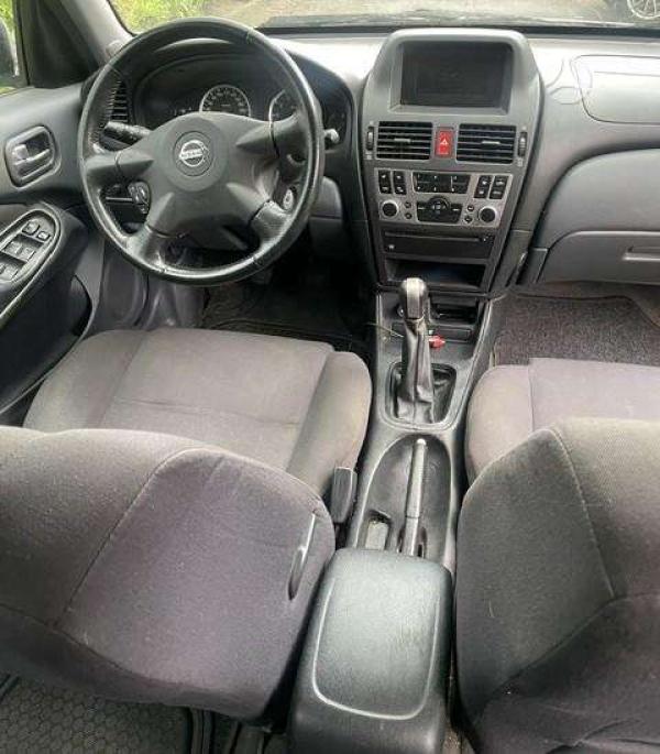Grey Nissan Almera 2006 in Panevezys, with an engine capacity of 1.50 L and mileage of 170 thousand km for 1700 €, photo 5 on AUTOMOTO.COM.LV