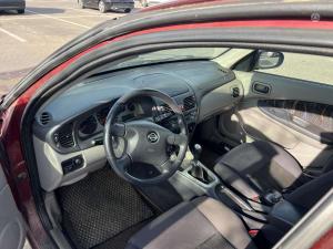 Red Nissan Almera 2002 in Vilnius, with an engine capacity of 1.50 L and mileage of 180 thousand km for 380 €, photo 10 on AUTOMOTO.COM.LV