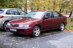 Sarkans Nissan Almera 1999 Tallina, ar dzinēja tilpumu 1.90 L un nobraukumu 186 tūkst. km par 600 €, foto  vietnē AUTOMOTO.COM.LV