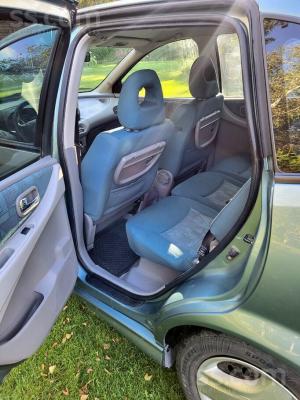 Green Nissan Almera Tino 2001 in Riga, with an engine capacity of 1.80 L and mileage of 92 thousand km for 2500 €, photo 12 on AUTOMOTO.COM.LV