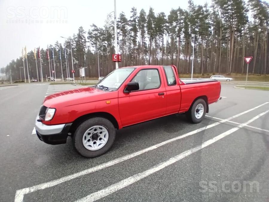 Red Nissan king-cab 2001 in Riga, with an engine capacity of 2.50 L and mileage of 148 thousand km for 7100 €, photo 1 on AUTOMOTO.COM.LV