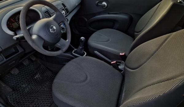 Black Nissan Micra 2009 in Riga, with an engine capacity of 1.20 L and mileage of 214 thousand km for 2990 €, photo 1 on AUTOMOTO.COM.LV
