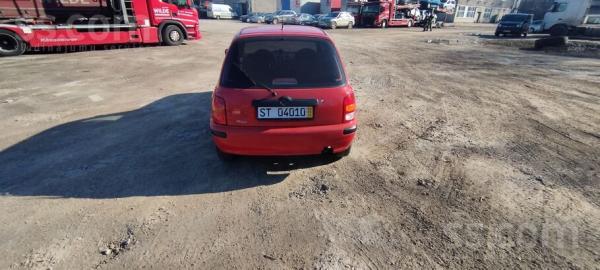 Red Nissan Micra 1999 in Riga, with an engine capacity of 1.00 L and mileage of 57 thousand km for 3499 €, photo 5 on AUTOMOTO.COM.LV
