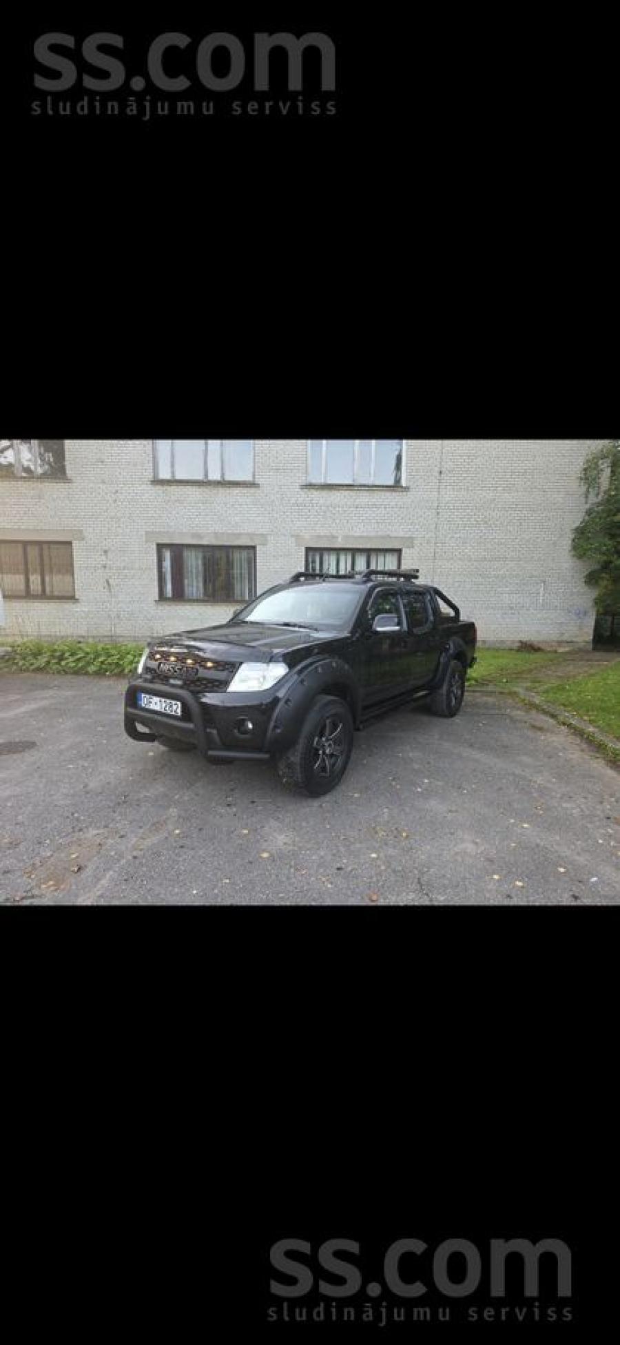 Black Nissan Navara 2014 in Dobele, with an engine capacity of 2.50 L and mileage of 265 thousand km for 12999 €, photo 3 on AUTOMOTO.COM.LV