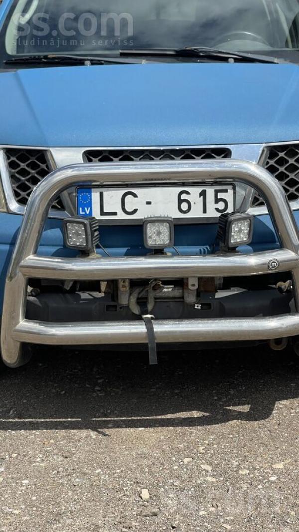Blue Nissan Navara 2007 in Saldus, with an engine capacity of 2.50 L and mileage of 430 thousand km for 8500 €, photo 4 on AUTOMOTO.COM.LV