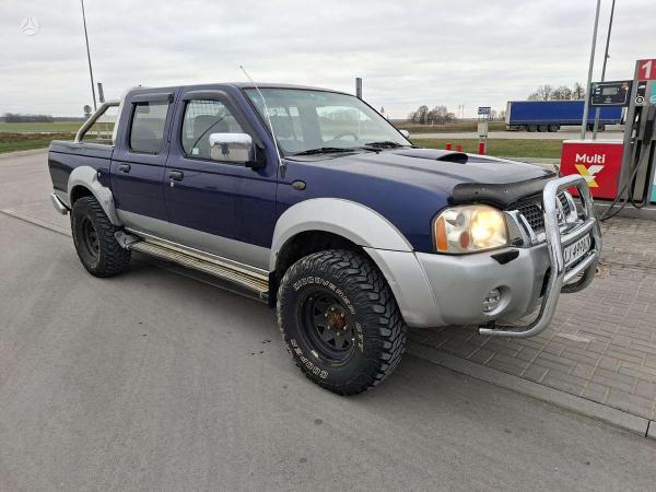 Blue Nissan Navara 2005 in Panevezys, with an engine capacity of 0.00 L and mileage of 300 thousand km for 4700 €, photo 1 on AUTOMOTO.COM.LV