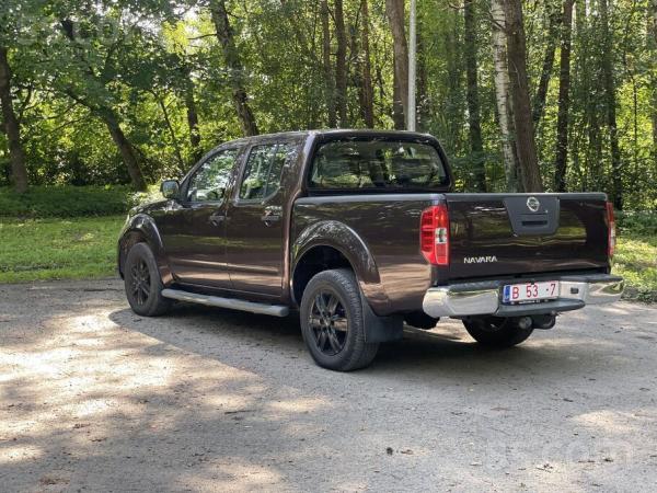 Brown Nissan Navara 2012 in Riga, with an engine capacity of 2.50 L and mileage of 205 thousand km for 7200 €, photo 5 on AUTOMOTO.COM.LV