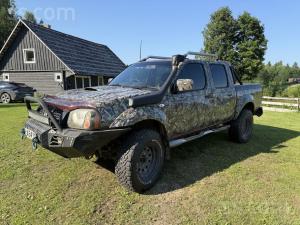 Brown Nissan Navara 2005 in Riga, with an engine capacity of 2.50 L and mileage of 170 thousand km for 6100 €, photo 1 on AUTOMOTO.COM.LV