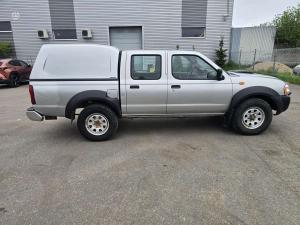Grey Nissan Navara 2011 in Vilnius, with an engine capacity of 2.49 L and mileage of 215 thousand km for 5000 €, photo 4 on AUTOMOTO.COM.LV