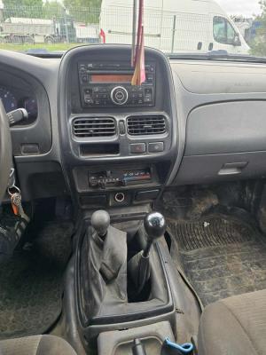 Grey Nissan Navara 2011 in Vilnius, with an engine capacity of 2.49 L and mileage of 215 thousand km for 5000 €, photo 12 on AUTOMOTO.COM.LV