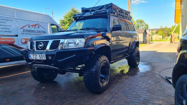 Melns Nissan Patrol 2009 Mažeikiai, ar dzinēja tilpumu 3.00 L un nobraukumu 318 tūkst. km par 21000 €, foto 1 vietnē AUTOMOTO.COM.LV