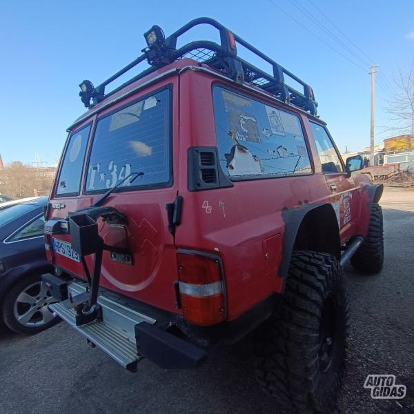 Red Nissan Patrol 1996 in Vilnius, with an engine capacity of 3.00 L and mileage of 300 thousand km for 9000 €, photo 4 on AUTOMOTO.COM.LV