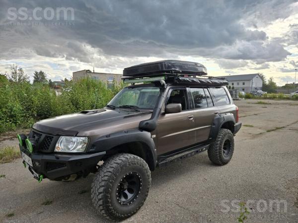 Violet Nissan Patrol 2006 in Jelgava, with an engine capacity of 3.00 L and mileage of 248 thousand km for 24900 €, photo 2 on AUTOMOTO.COM.LV