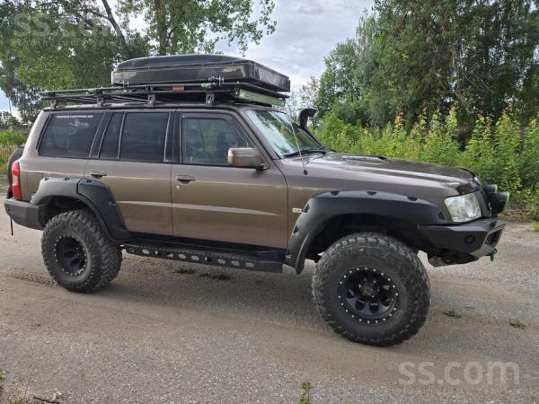 Violet Nissan Patrol 2006 in Jelgava, with an engine capacity of 3.00 L and mileage of 248 thousand km for 24900 €, photo 5 on AUTOMOTO.COM.LV