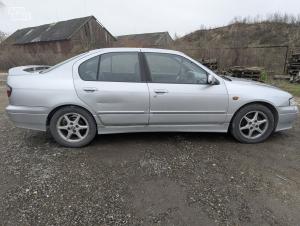 Grey Nissan Primera 1997 in Marijampole, with an engine capacity of 2.00 L and mileage of 227 thousand km for 1450 €, photo 4 on AUTOMOTO.COM.LV