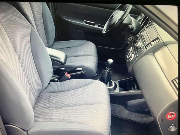 Grey Nissan TIIDA 2008 in Prienai, with an engine capacity of 1.80 L and mileage of 171 thousand km for 1999 €, photo 8 on AUTOMOTO.COM.LV