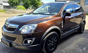 Red Opel Antara 2014 in Kretinga, with an engine capacity of 2.23 L and mileage of 184 thousand km for 6150 €, photo 8 on AUTOMOTO.COM.LV