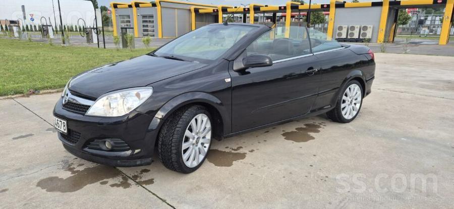 Black Opel Astra 2008 in Riga, with an engine capacity of 1.90 L and mileage of 210 thousand km for 3690 €, photo 3 on AUTOMOTO.COM.LV
