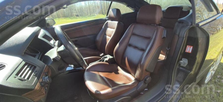 Black Opel Astra 2008 in Riga, with an engine capacity of 1.90 L and mileage of 210 thousand km for 3690 €, photo 11 on AUTOMOTO.COM.LV