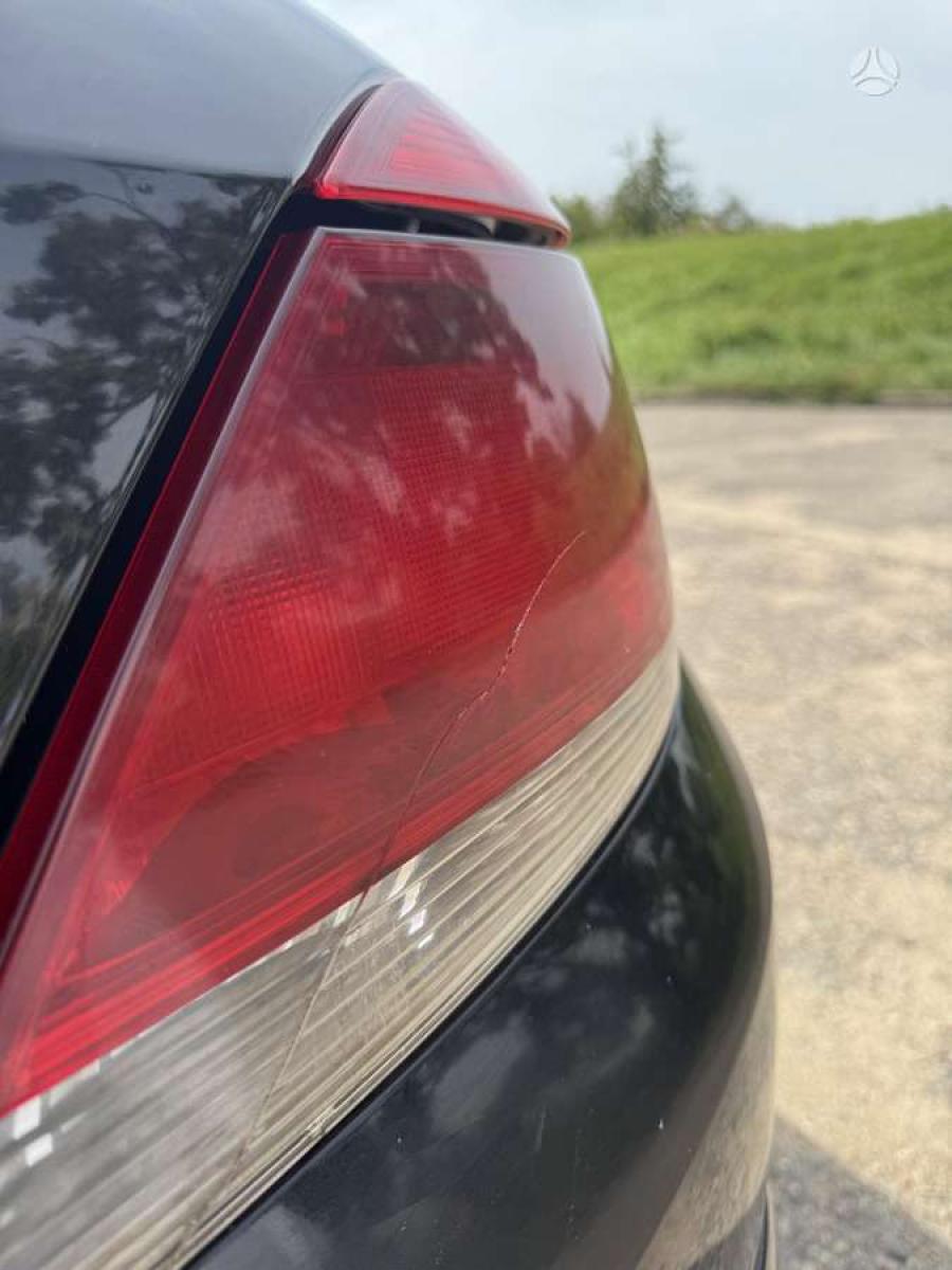 Black Opel Astra 2008 in Kaunas, with an engine capacity of 1.90 L and mileage of 311 thousand km for 2200 €, photo 20 on AUTOMOTO.COM.LV