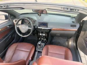Black Opel Astra 2008 in Birstonas, with an engine capacity of 1.90 L and mileage of 219 thousand km for 3150 €, photo 22 on AUTOMOTO.COM.LV