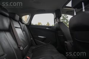 Black Opel Astra 2011 in Riga, with an engine capacity of 2.00 L and mileage of 241 thousand km for 4990 €, photo 21 on AUTOMOTO.COM.LV