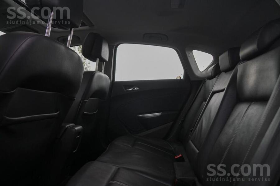 Black Opel Astra 2011 in Riga, with an engine capacity of 2.00 L and mileage of 241 thousand km for 4990 €, photo 22 on AUTOMOTO.COM.LV