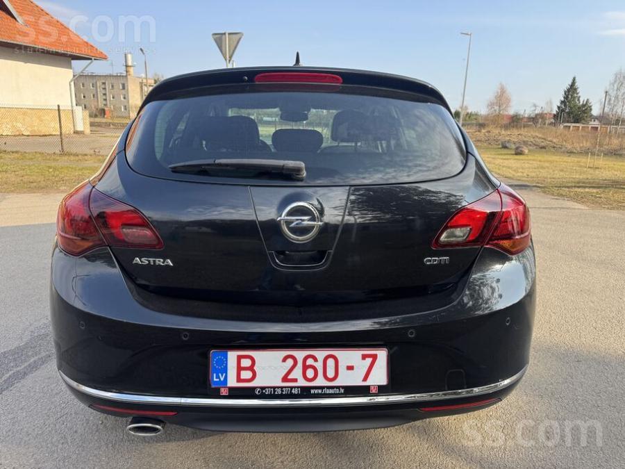 Black Opel Astra 2014 in Ogre, with an engine capacity of 2.00 L and mileage of 238 thousand km for 5250 €, photo 13 on AUTOMOTO.COM.LV