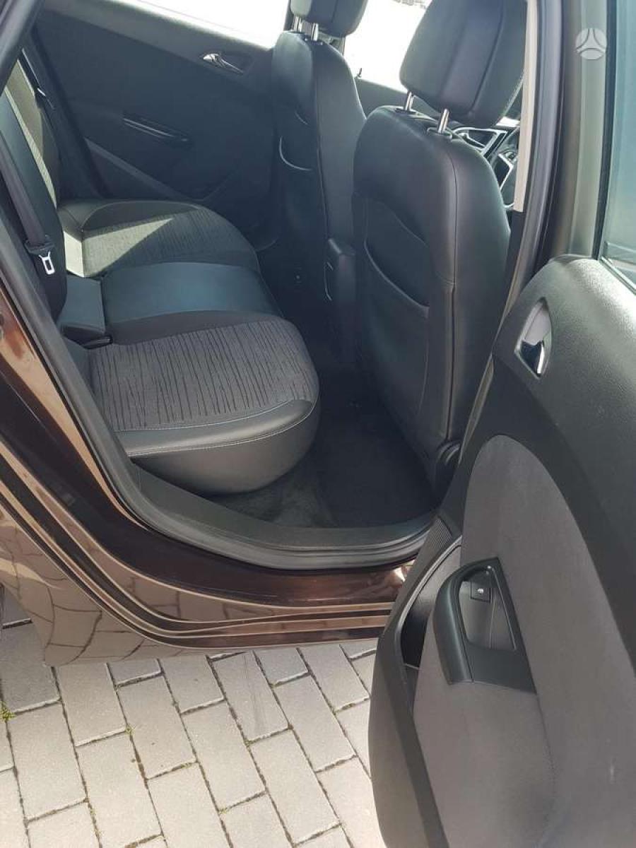Black Opel Astra 2014 in Marijampole, with an engine capacity of 1.60 L and mileage of 188 thousand km for 4499 €, photo 12 on AUTOMOTO.COM.LV