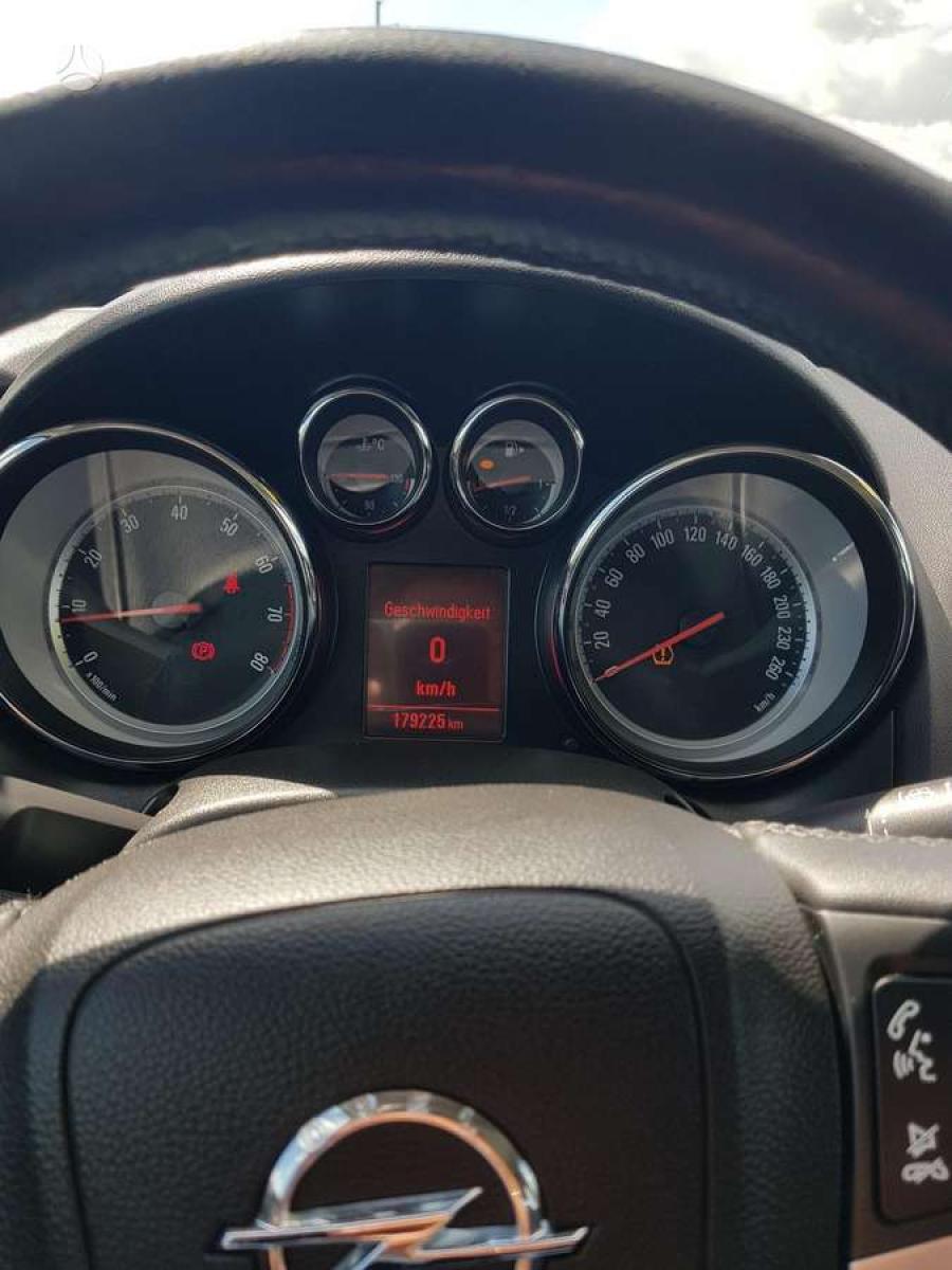Black Opel Astra 2014 in Marijampole, with an engine capacity of 1.60 L and mileage of 188 thousand km for 4499 €, photo 18 on AUTOMOTO.COM.LV