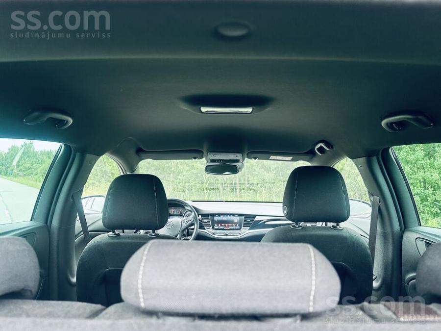 Black Opel Astra 2016 in Tukums, with an engine capacity of 1.60 L and mileage of 265 thousand km for 5700 €, photo 13 on AUTOMOTO.COM.LV