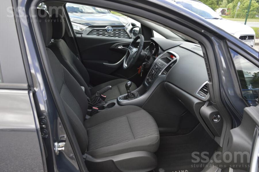 Black Opel Astra 2013 in Tukums, with an engine capacity of 1.60 L and mileage of 133 thousand km for 5595 €, photo 12 on AUTOMOTO.COM.LV