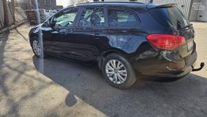 Black Opel Astra 2011 in Vilnius, with an engine capacity of 1.70 L and mileage of 303 thousand km for 1700 €, photo 7 on AUTOMOTO.COM.LV