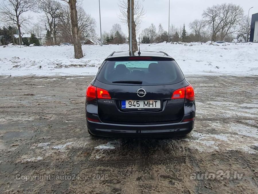 Black Opel Astra 2012 in Tallinn, with an engine capacity of 1.60 L and mileage of 347 thousand km for 2599 €, photo 4 on AUTOMOTO.COM.LV