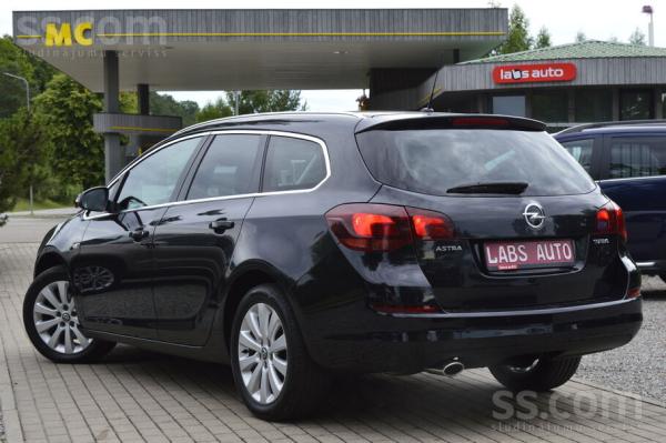 Black Opel Astra 2012 in Tukums, with an engine capacity of 1.60 L and mileage of 210 thousand km for 5395 €, photo 4 on AUTOMOTO.COM.LV