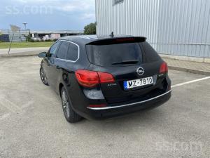Black Opel Astra 2013 in Riga, with an engine capacity of 1.70 L and mileage of 260 thousand km for 4560 €, photo 6 on AUTOMOTO.COM.LV