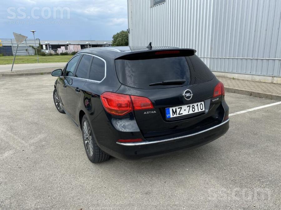 Black Opel Astra 2013 in Riga, with an engine capacity of 1.70 L and mileage of 260 thousand km for 4560 €, photo 6 on AUTOMOTO.COM.LV