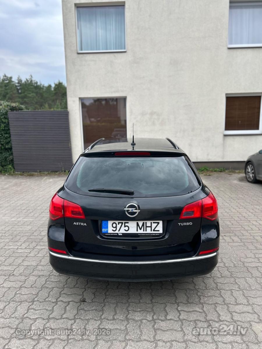 Black Opel Astra 2013 in Tallinn, with an engine capacity of 1.40 L and mileage of 132 thousand km for 5490 €, photo 7 on AUTOMOTO.COM.LV