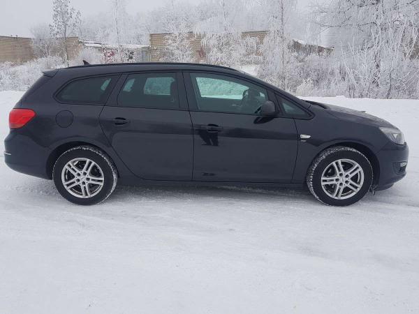 Black Opel Astra 2014 in Radviliskis, with an engine capacity of 1.36 L and mileage of 237 thousand km for 4350 €, photo 8 on AUTOMOTO.COM.LV