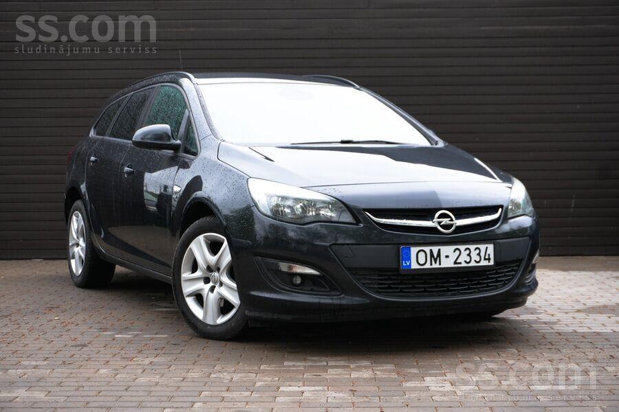 Black Opel Astra 2014 in Riga, with an engine capacity of 2.00 L and mileage of 283 thousand km for 5490 €, photo 3 on AUTOMOTO.COM.LV
