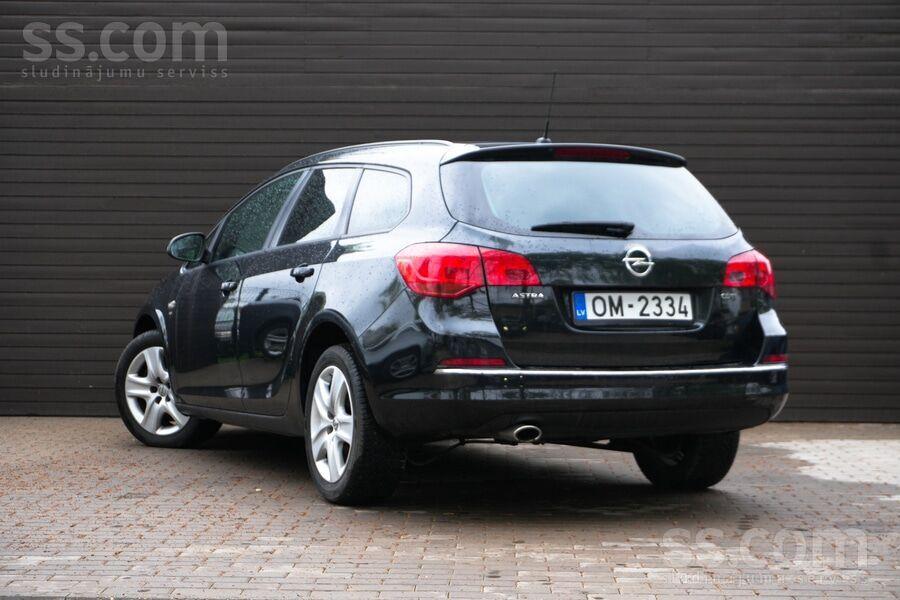 Black Opel Astra 2014 in Riga, with an engine capacity of 2.00 L and mileage of 283 thousand km for 5490 €, photo 5 on AUTOMOTO.COM.LV